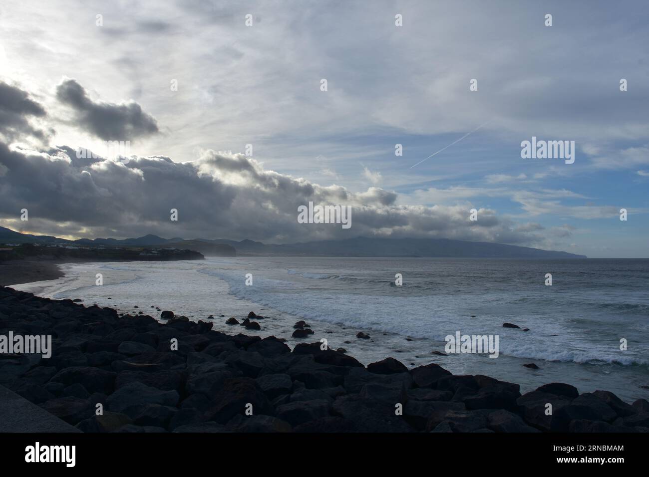 Sun dipping behind the clouds in Ribeira Grande on Sao Miguel Stock ...