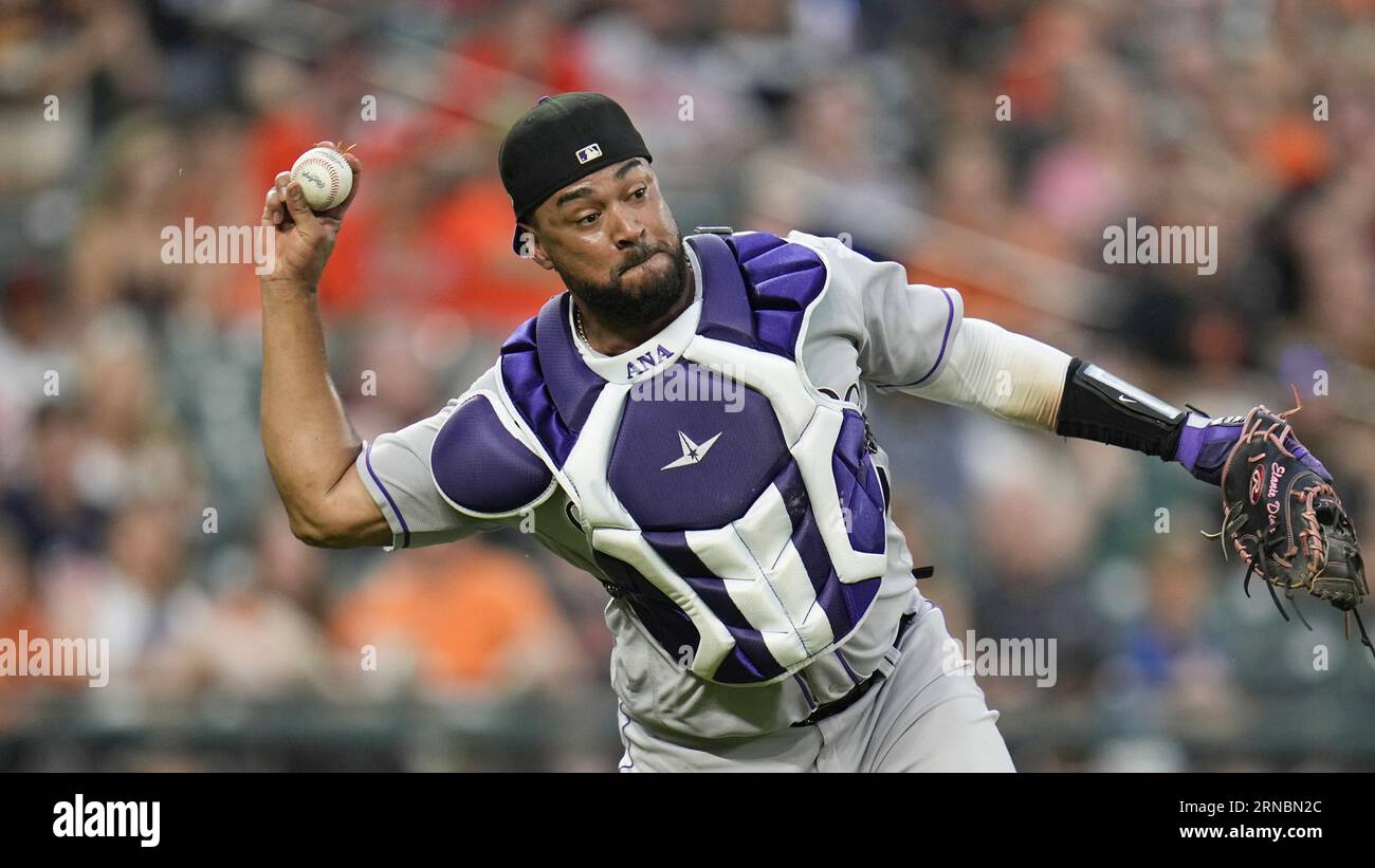 Colorado Rockies catcher Elias Diaz throws to first base to put out ...