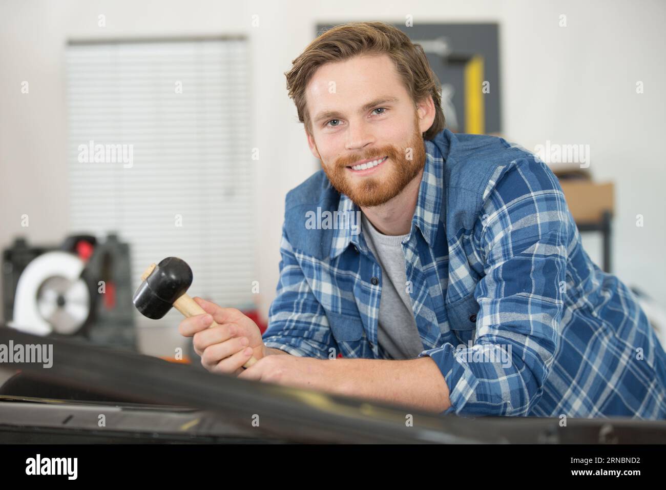 panel beating in a garage Stock Photo - Alamy