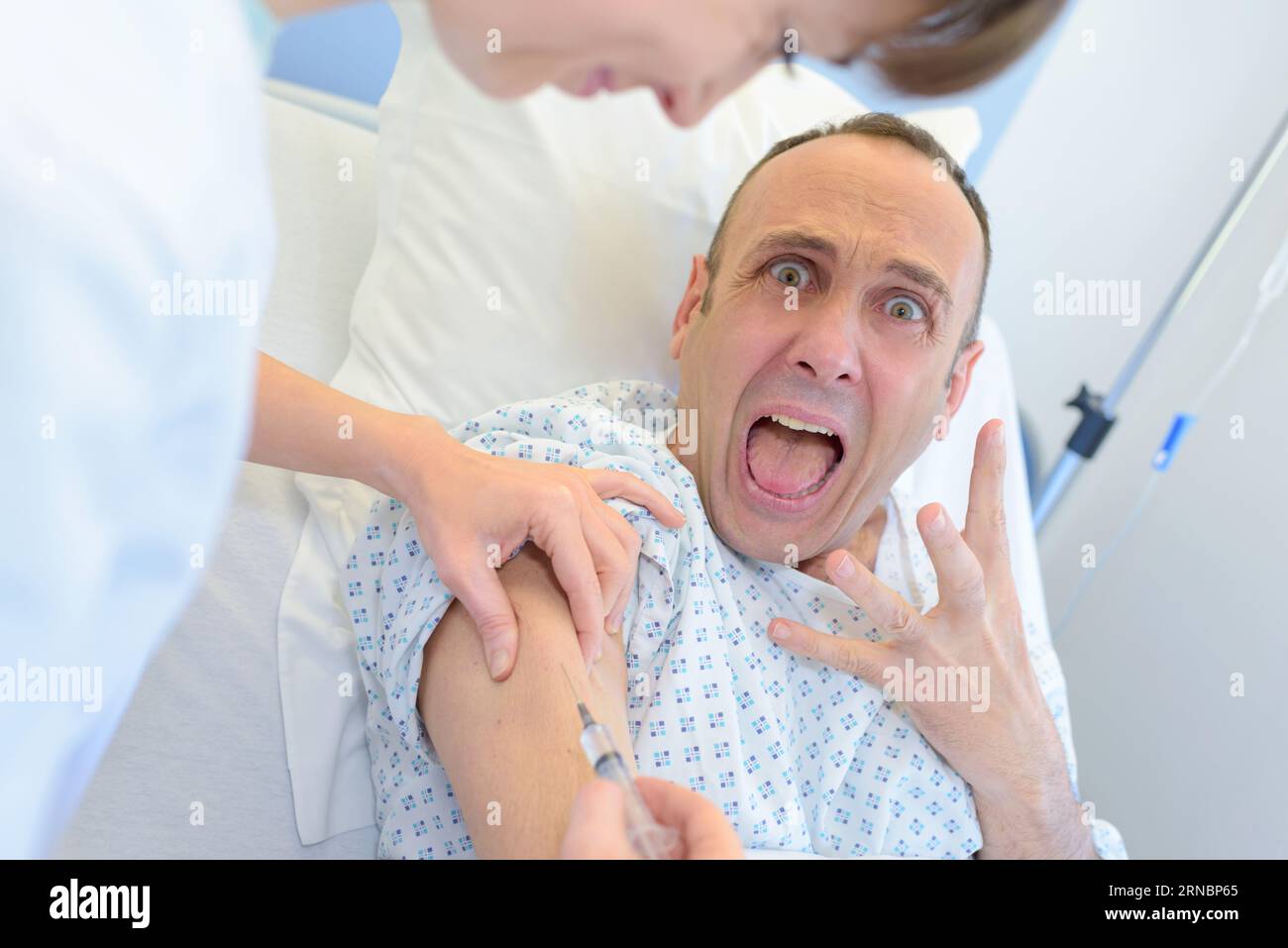 man is frightened of syringes Stock Photo - Alamy