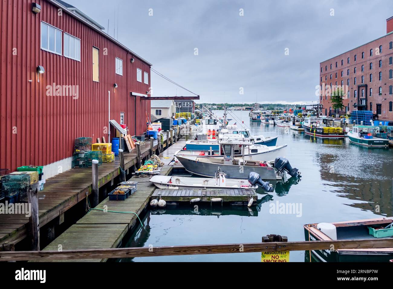 Boats docked in industrial harbor in Portland, Maine Stock Photo - Alamy