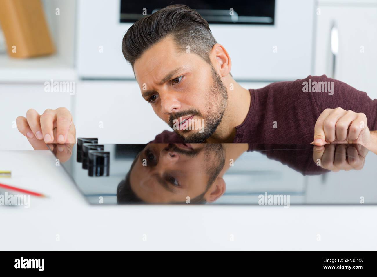 kitchen installer at carpenter work Stock Photo - Alamy