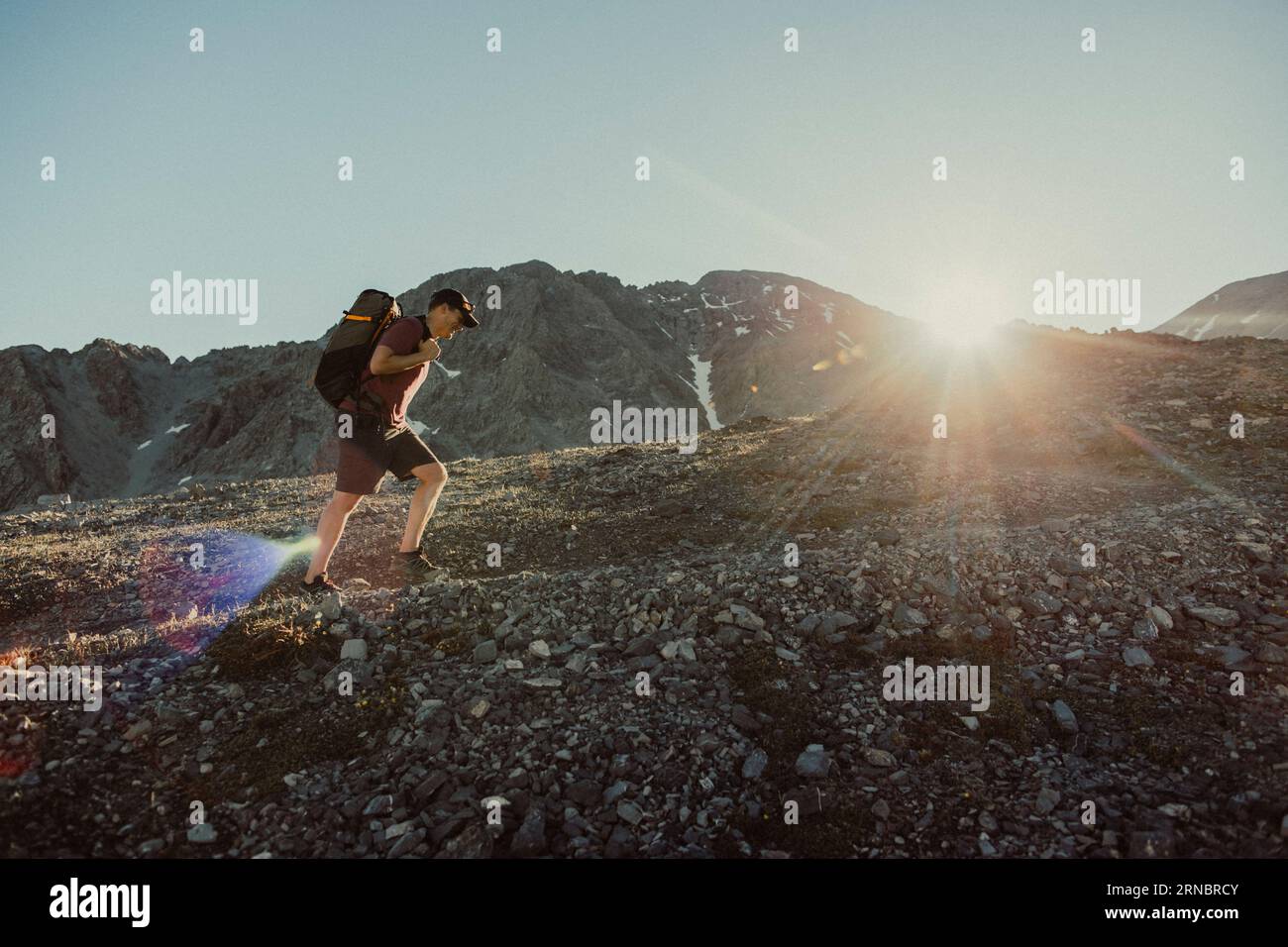 A white male hikes up a rocky path in the mountains Stock Photo - Alamy