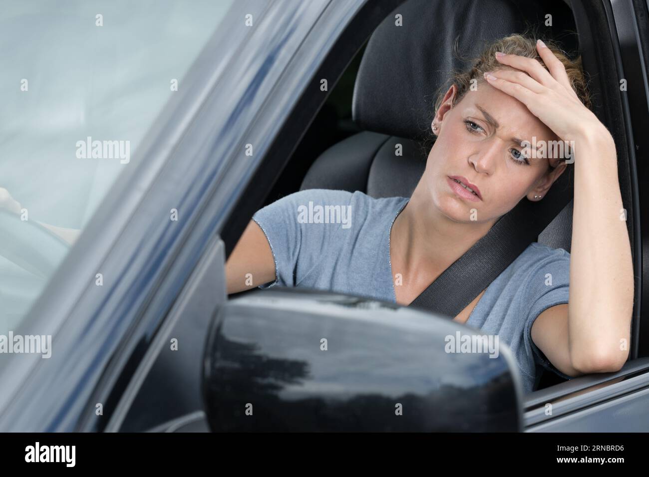 bored woman in a car Stock Photo - Alamy