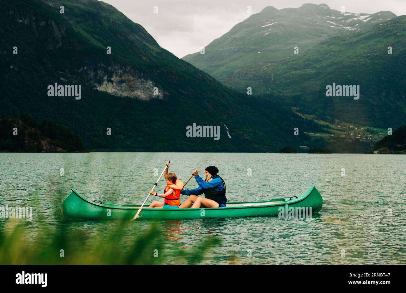 mother and son happily canoeing on a Norwegian Fjord Stock Photo - Alamy