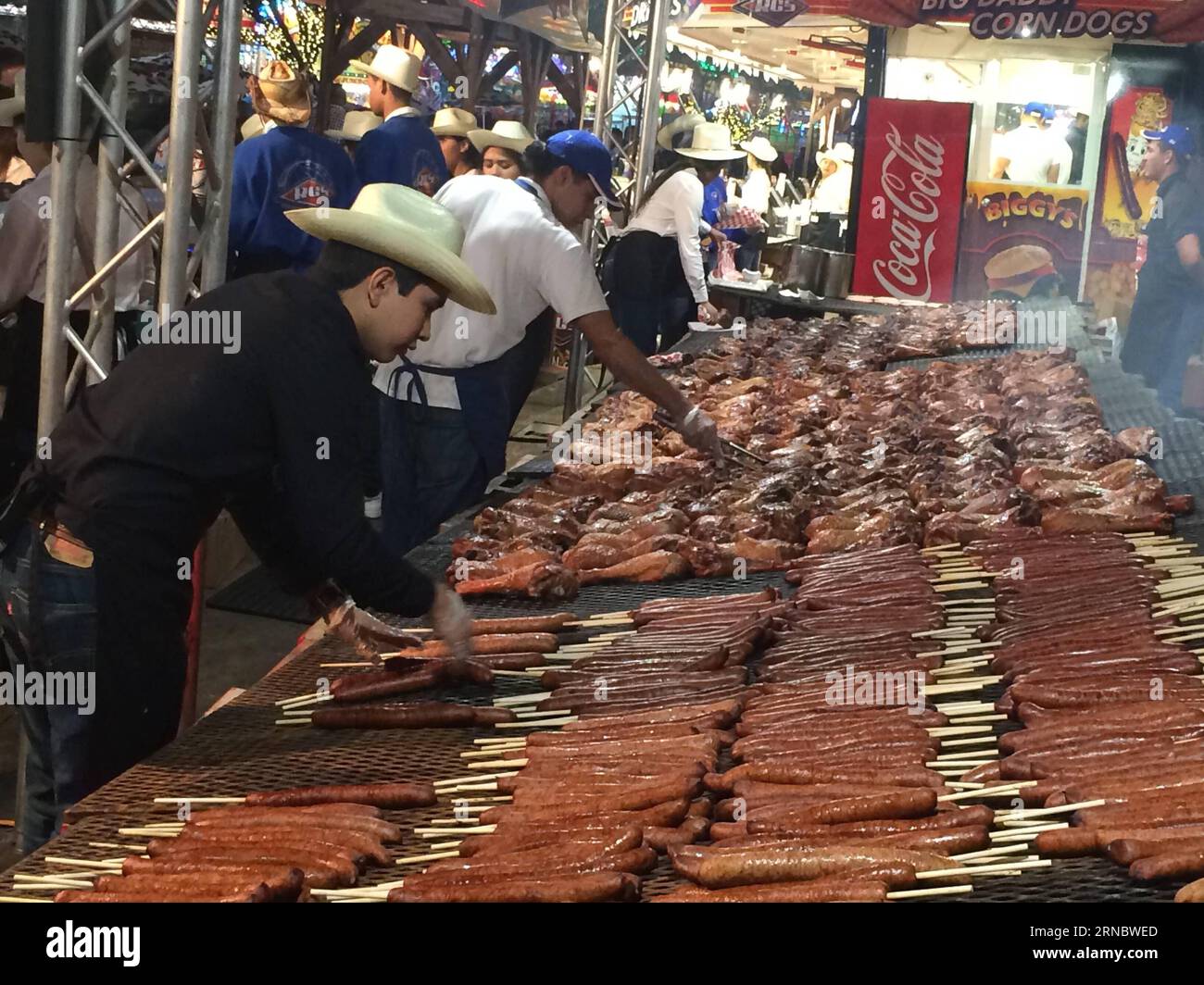 (160312) -- HOUSTON, March 11, 2016 -- People roast meat for selling ...