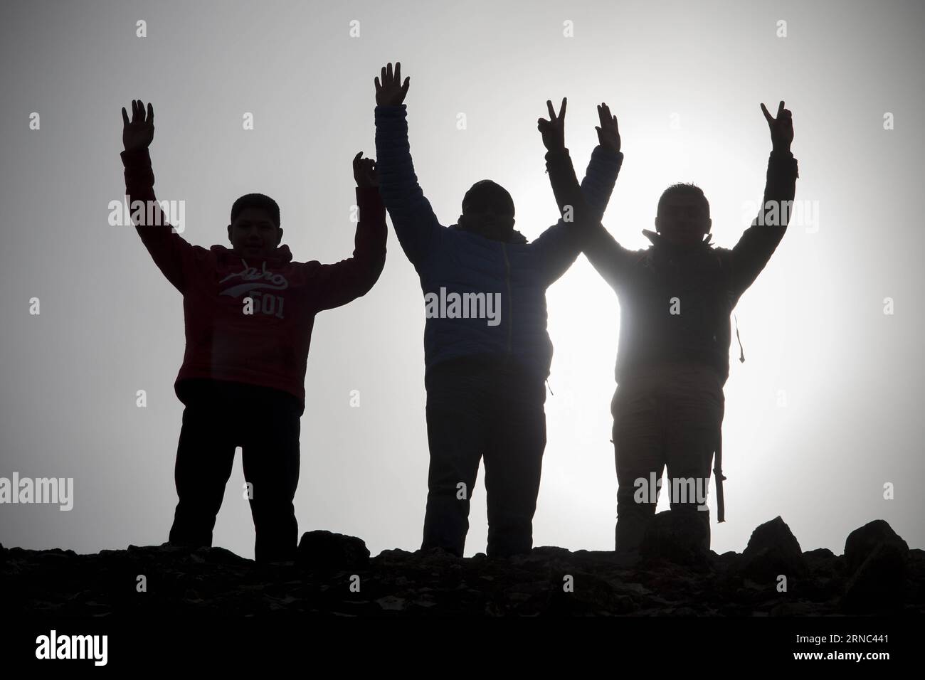 People raise their hands on the Pyramid of the Sun during the ...