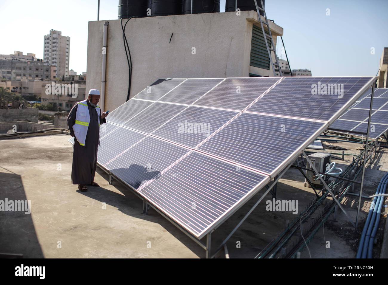 Rooftop solar panels are seen on the roof of a hospital, in Gaza City ...