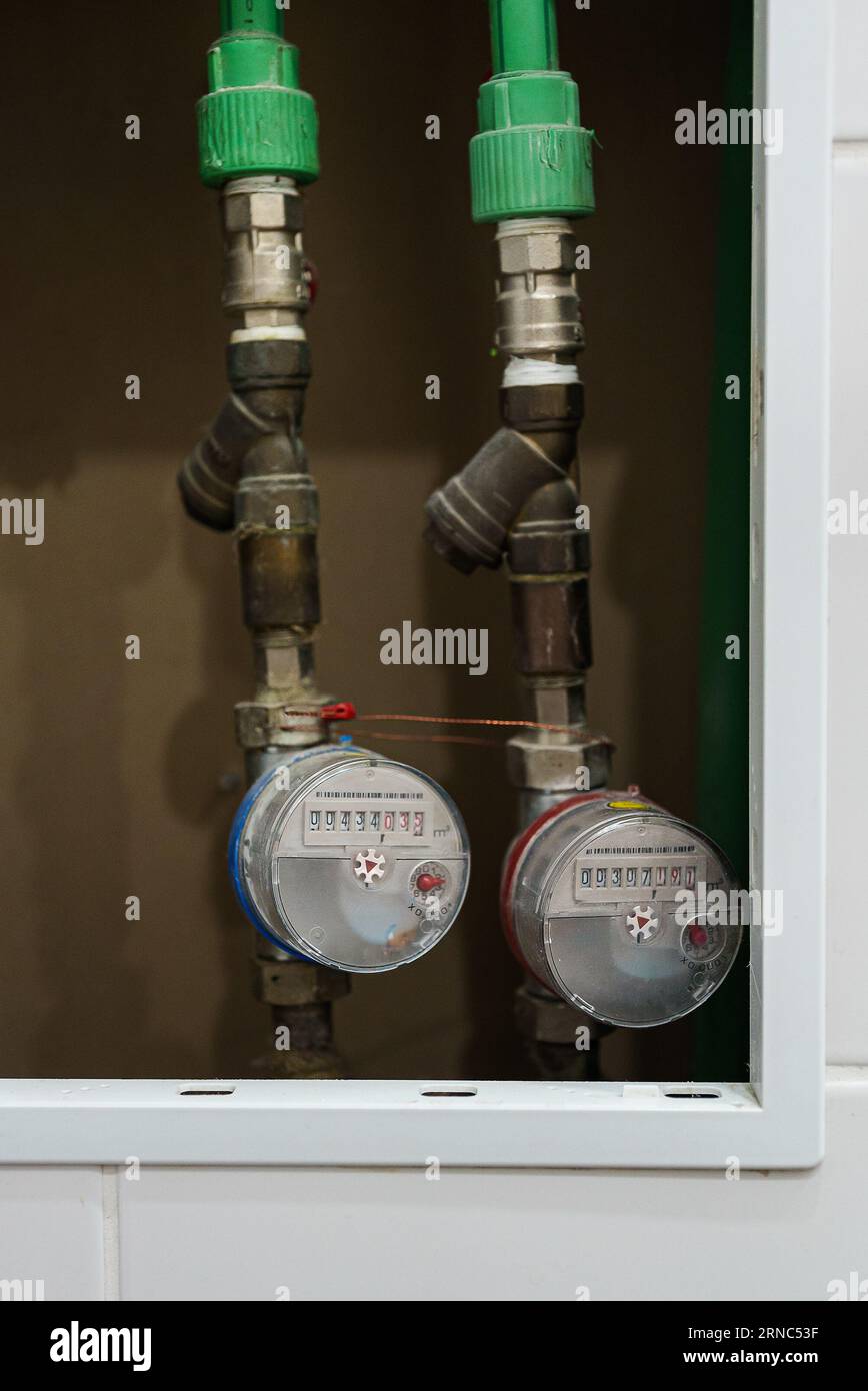 Water meters for cold and hot water Stock Photo - Alamy