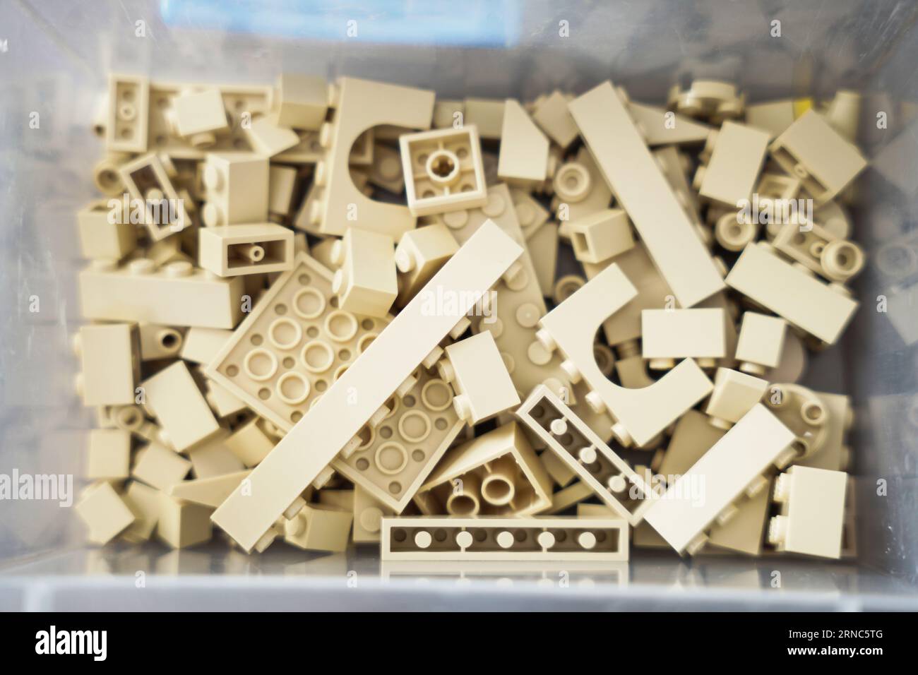 A collection of beige or one color building blocks legos on white ...