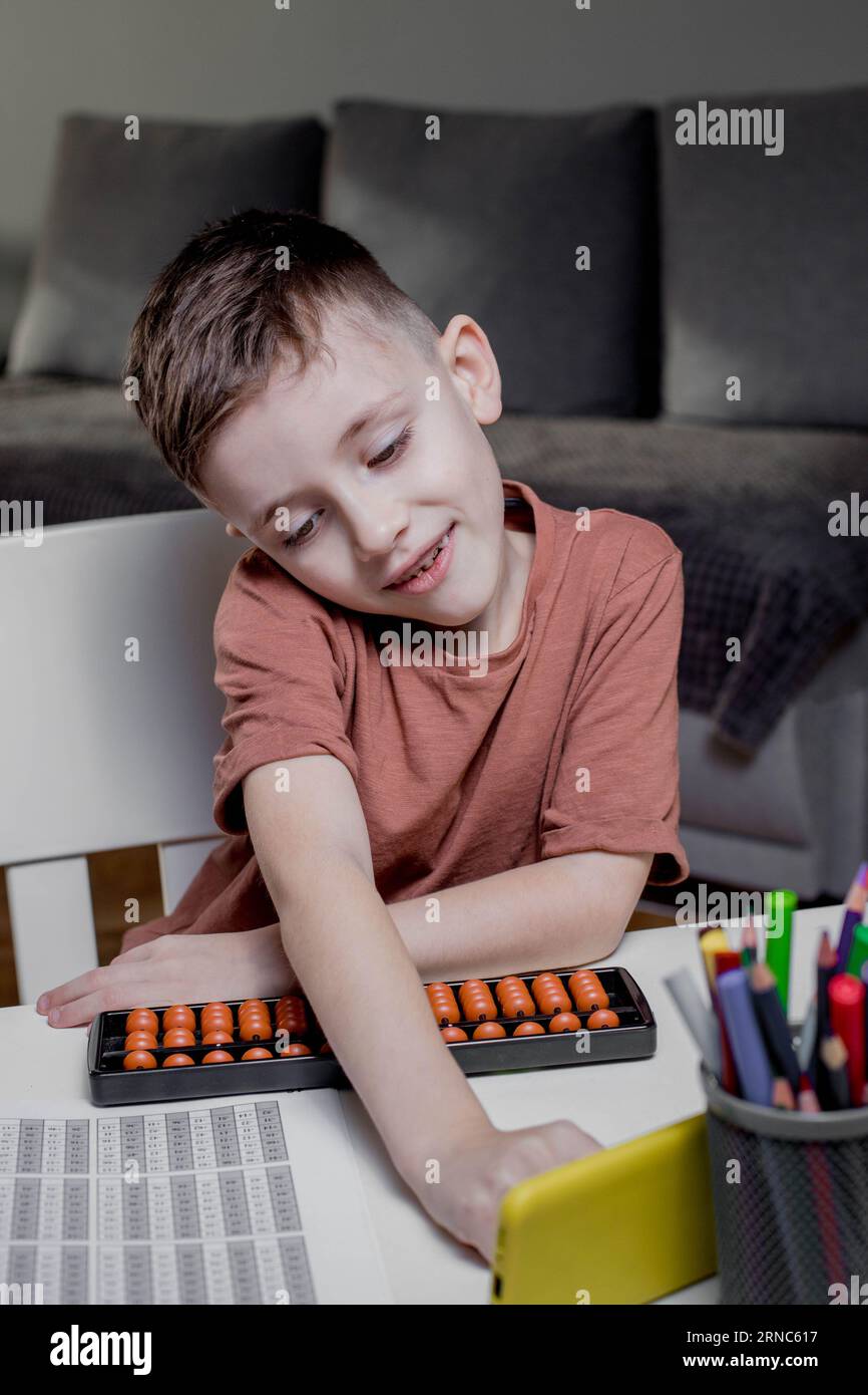 Smart cute boy thinking math hi-res stock photography and images - Alamy