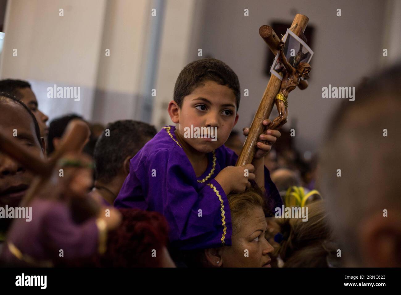(160324) -- CARACAS, March 24, 2016 -- A child holds a cross at Santa ...