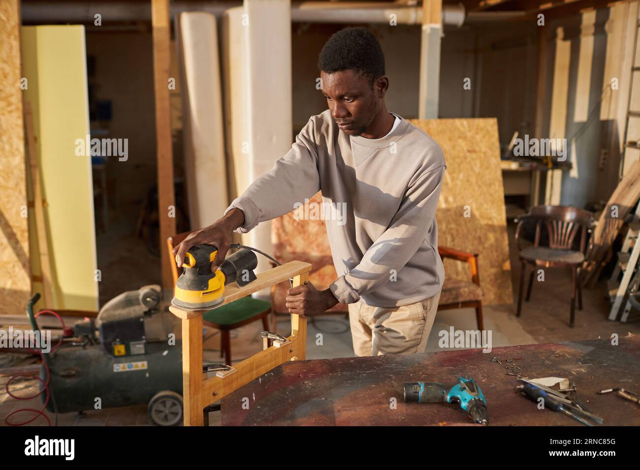 African carpenter cutting wooden hi-res stock photography and images ...