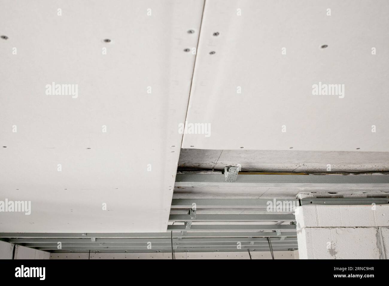 Structure with profiles and plasterboard for installation of suspended ...