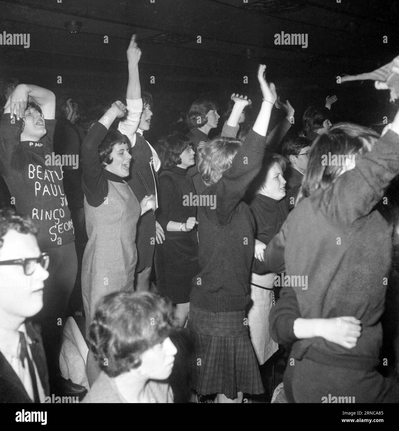 Beatlemania, the mass hysteria sparked by the Beatles pop singers from ...