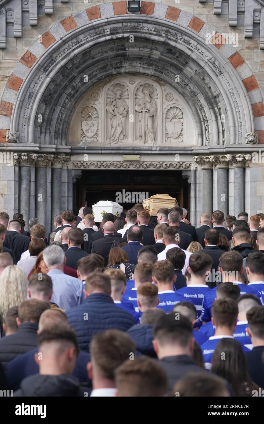 The coffins of siblings Luke, 24, and Grace McSweeney, 18, are carried ...