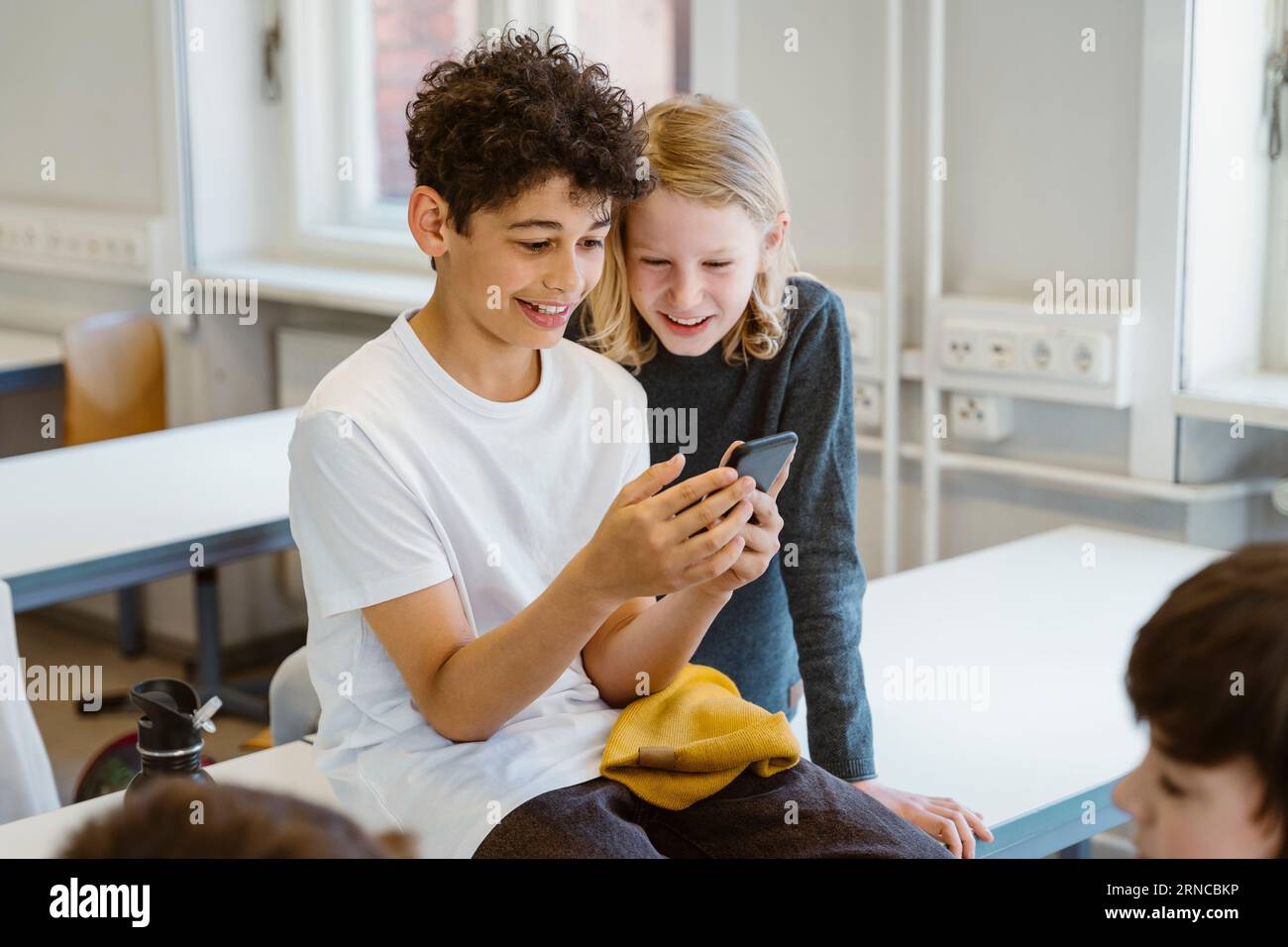 Curious smart boy sitting hi-res stock photography and images - Alamy