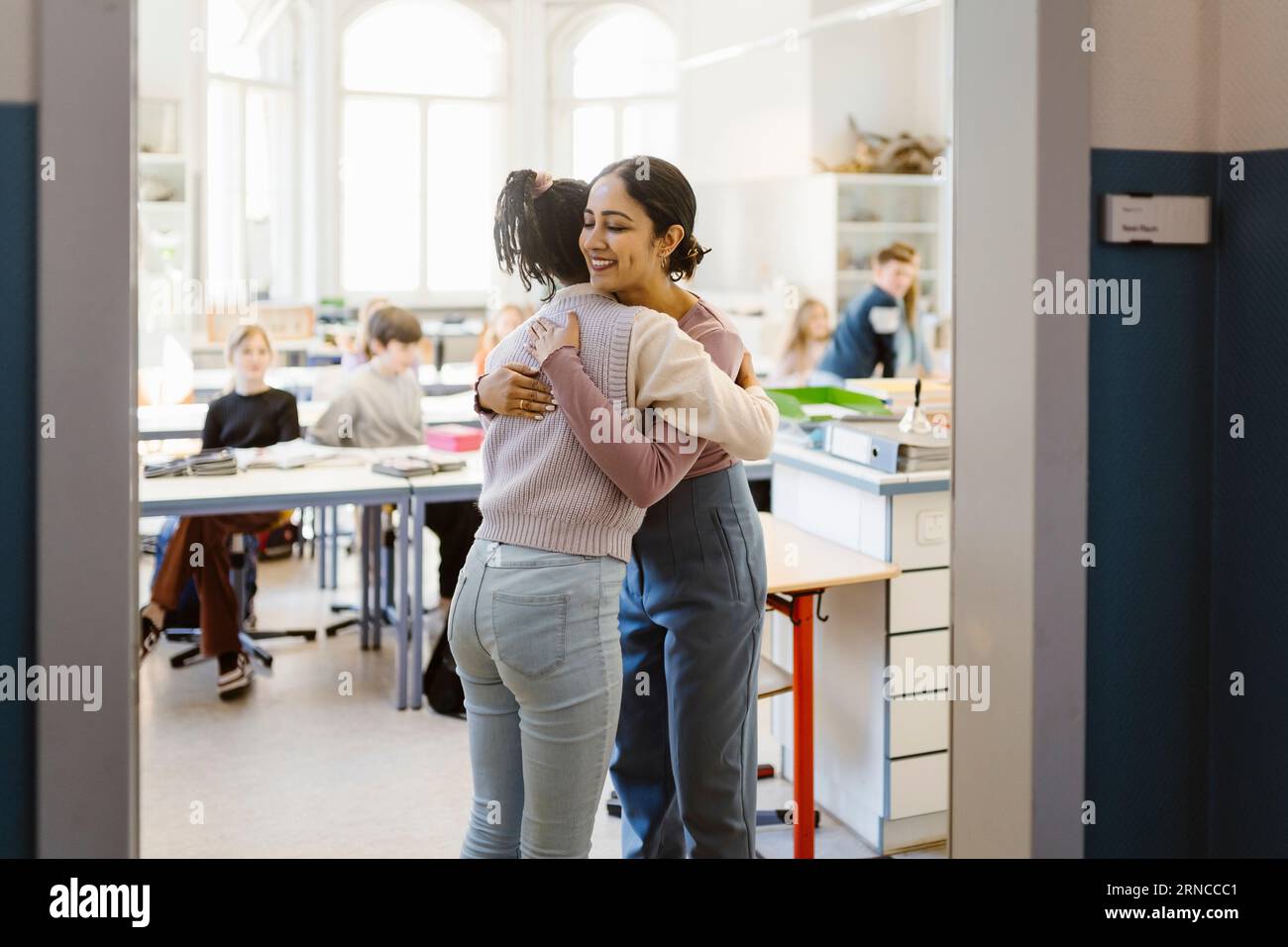 Young schoolgirl with teacher hi-res stock photography and images - Alamy