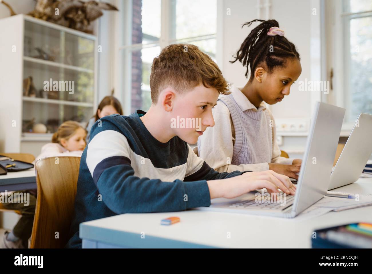 Two boys using laptop school hi-res stock photography and images - Alamy