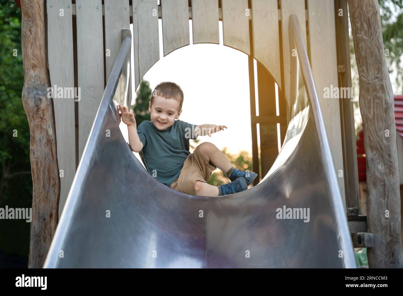 Going down the slide hi-res stock photography and images - Alamy