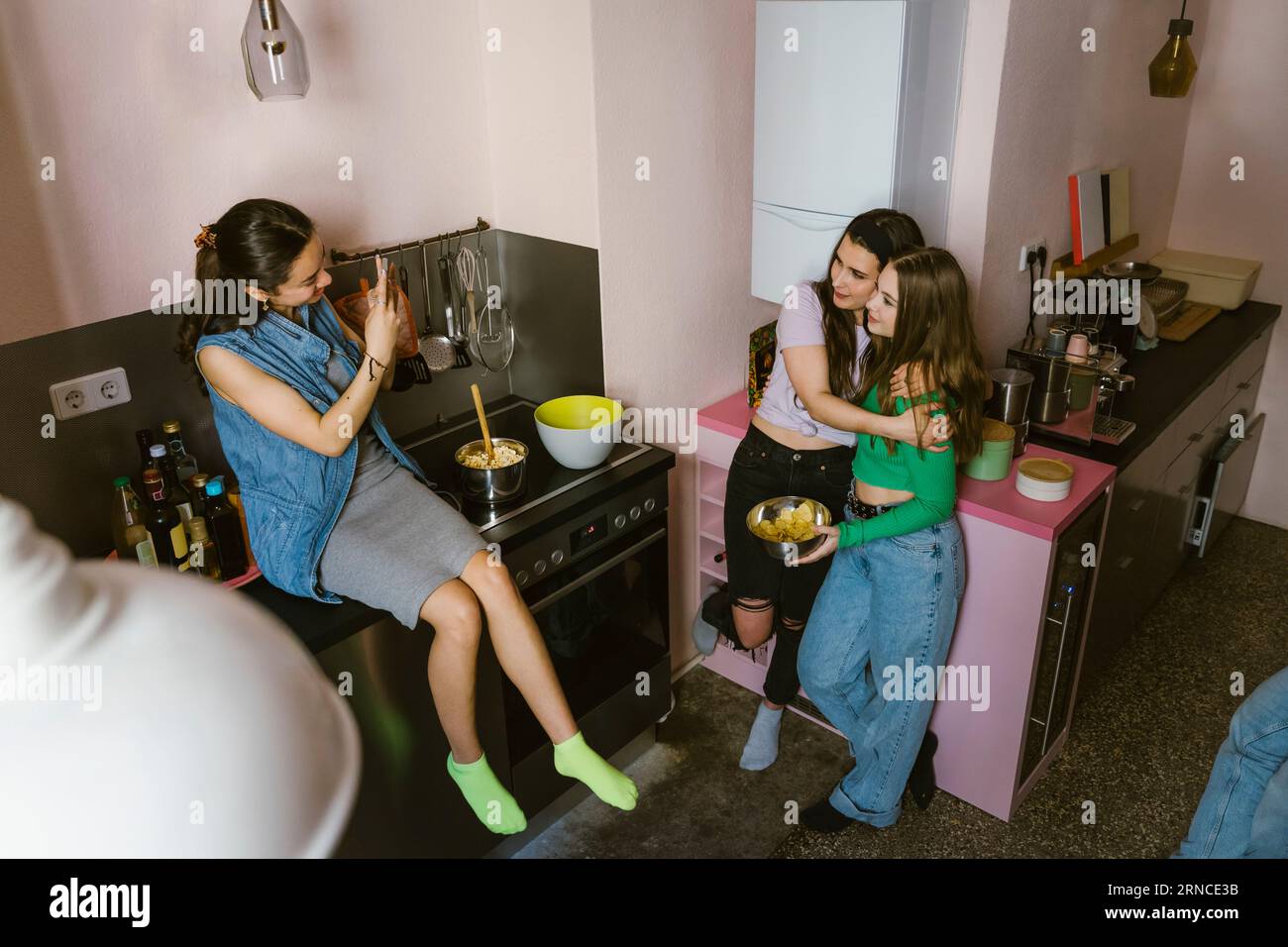 Sitting on counter hi-res stock photography and images - Alamy