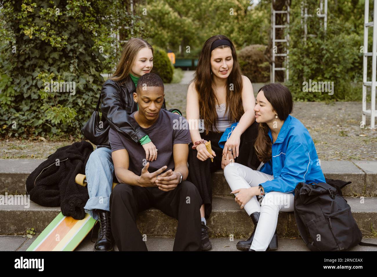 Four young men talking hi-res stock photography and images - Alamy