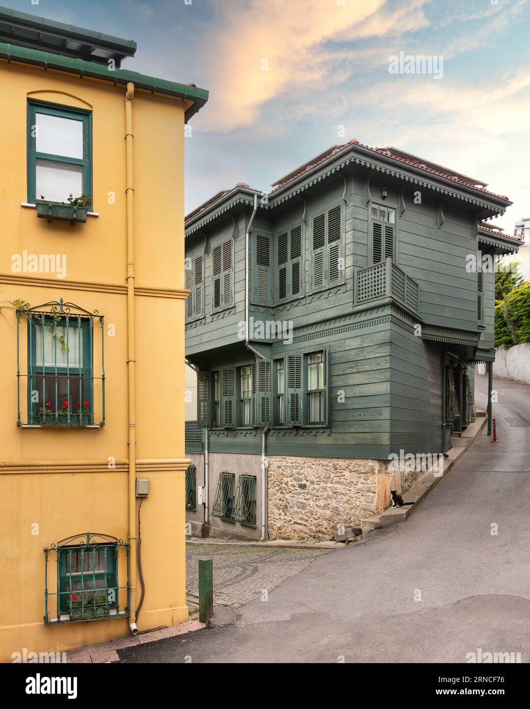 Facade of colorful wooden residential buildings painted in green and ...