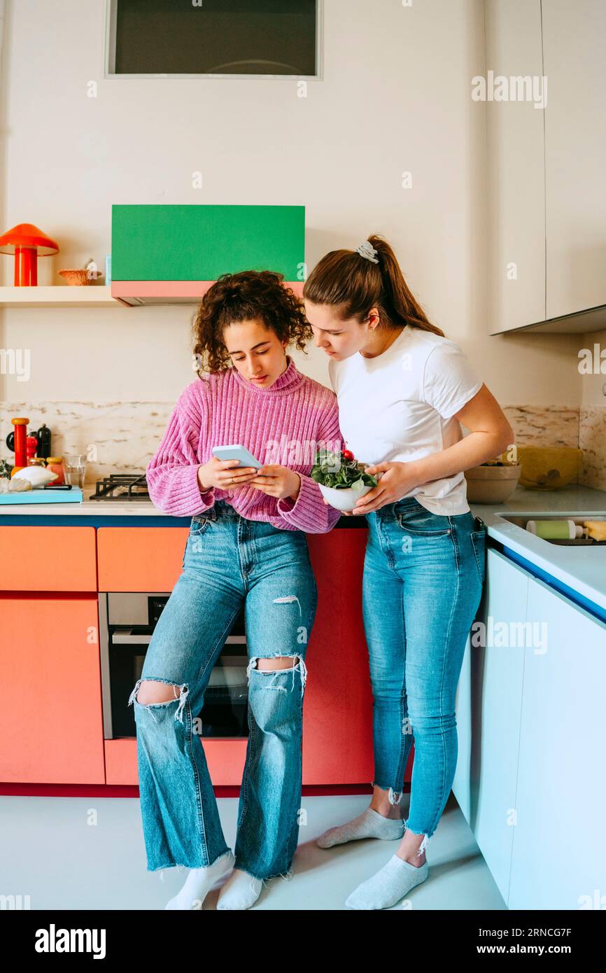 People standing friends full length interior hi-res stock photography ...