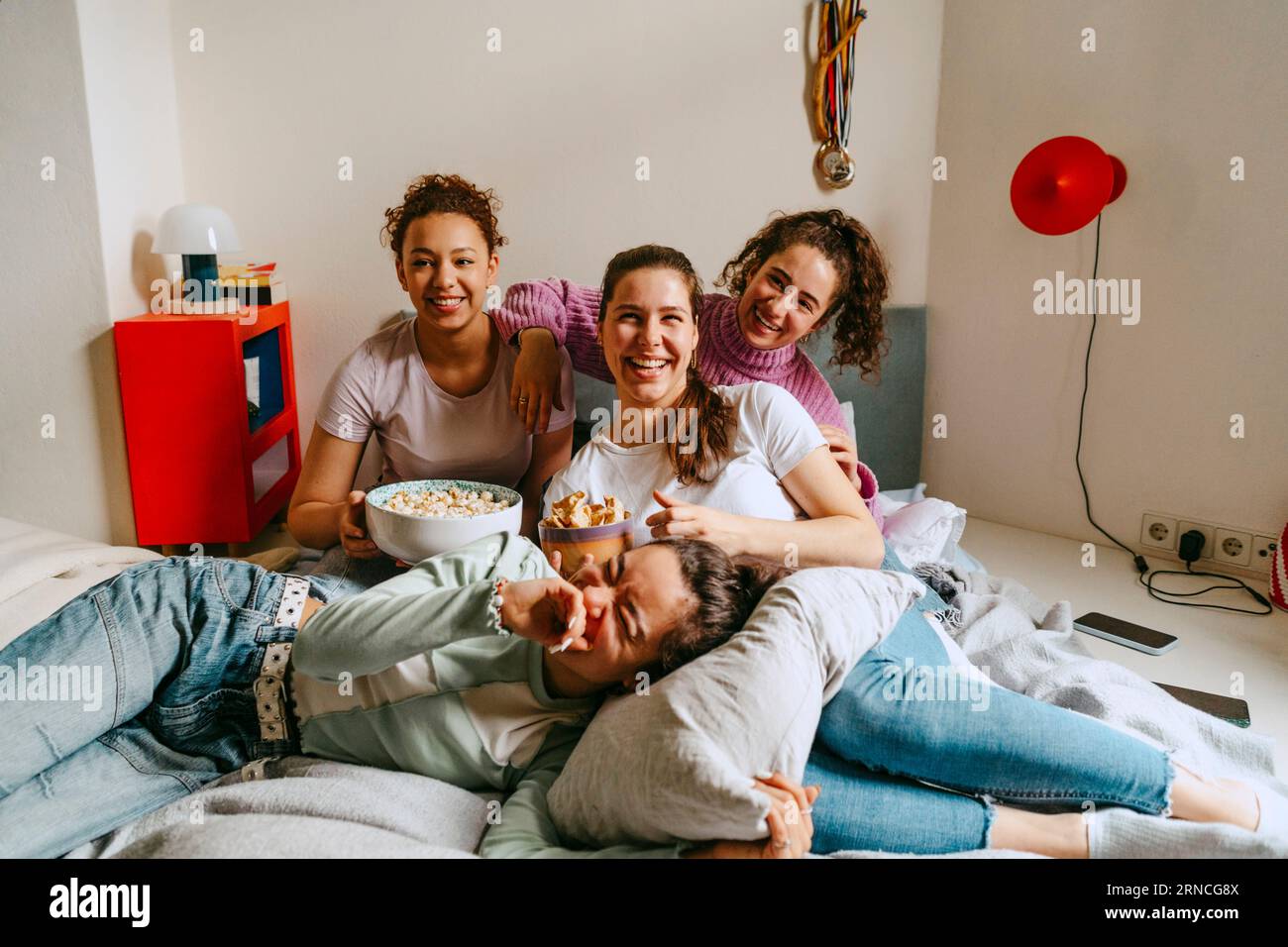 Teenager watching tv snack hi-res stock photography and images - Alamy