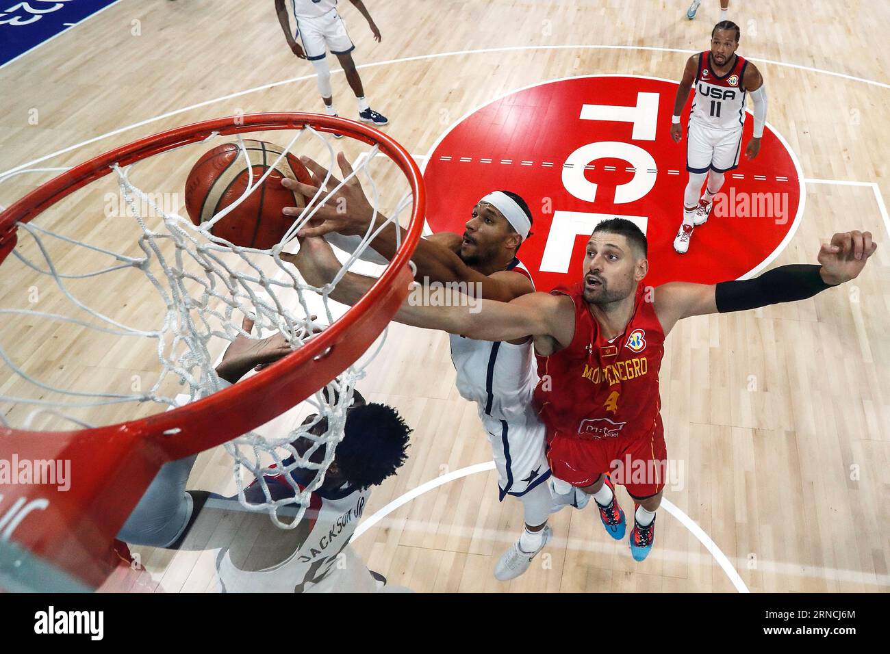 Team USA forward Josh Hart, left, competes for a rebound against ...