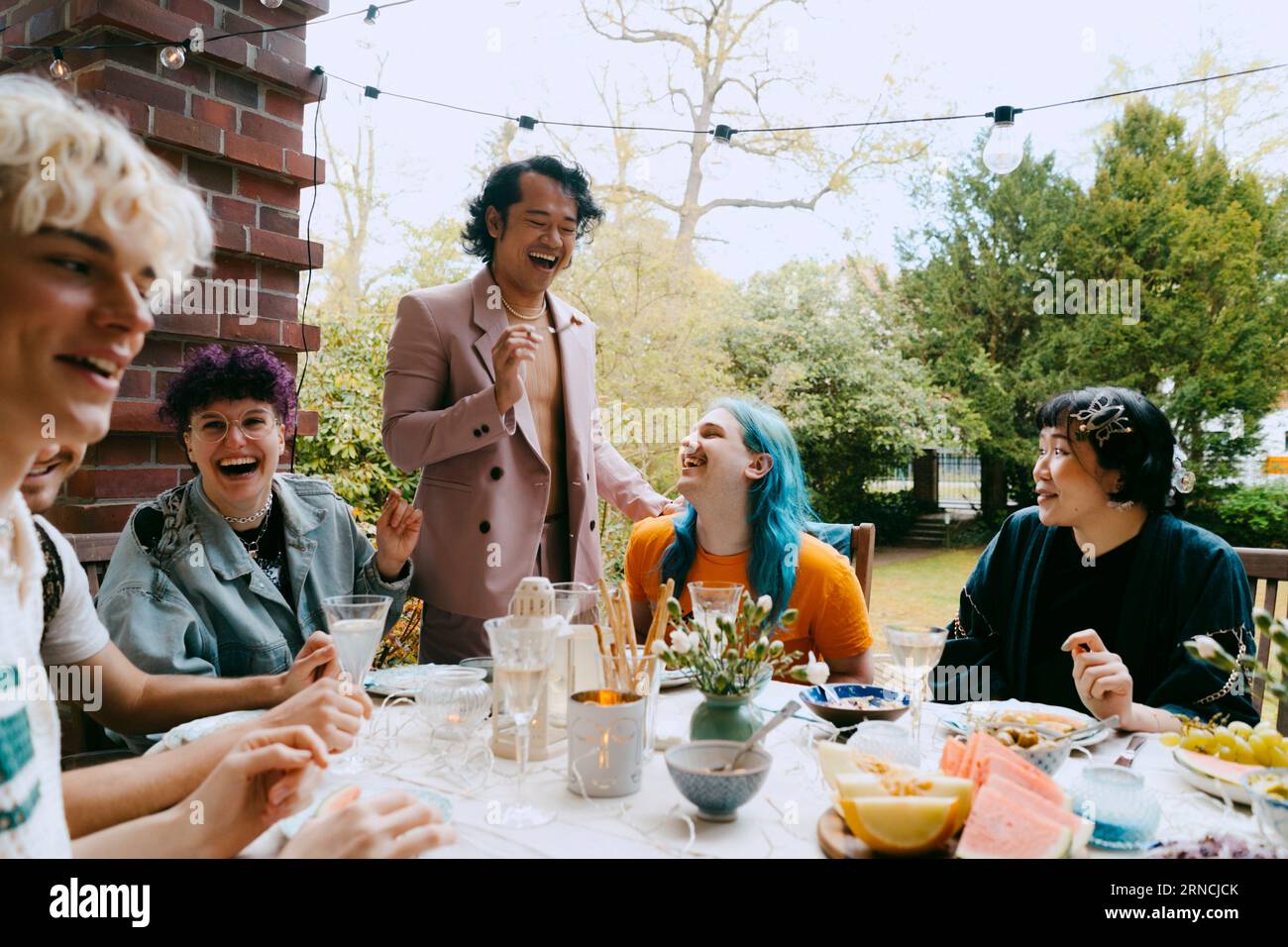 Happy friends of LGBTQ community having fun with each other during ...