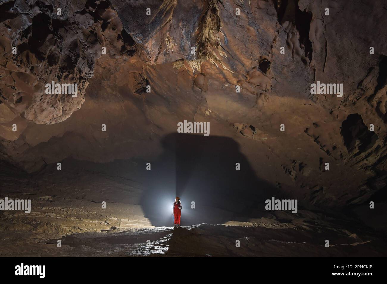 Miao-Kammer in Ziyun, China - An expedition member works within the ...