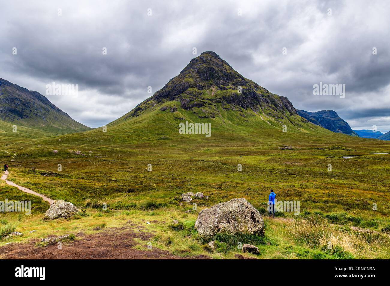 Hiker under a stormy sky hi-res stock photography and images - Alamy
