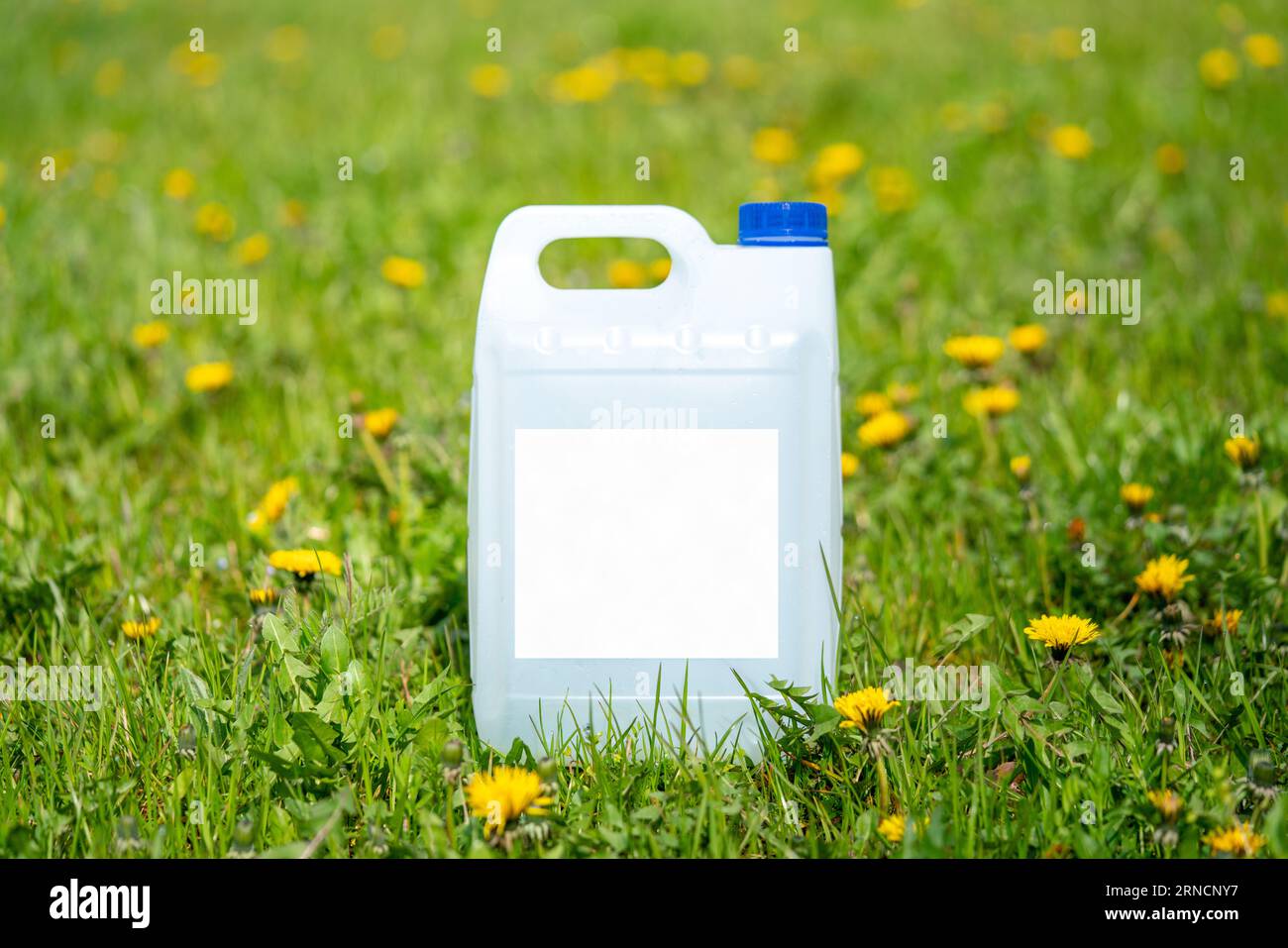white plastic container with agricultural chemicals or fertilizers on a ...