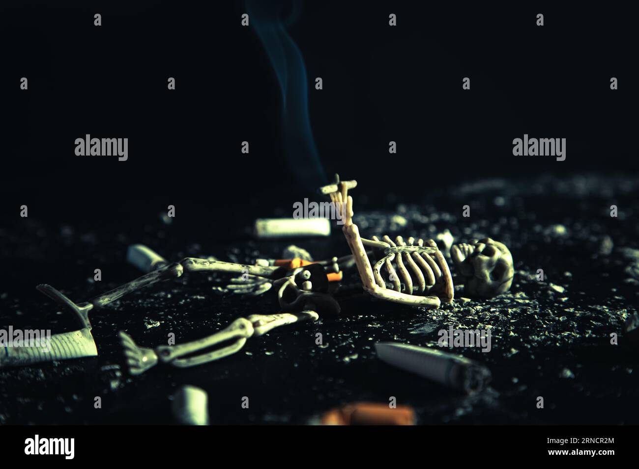 Human skeleton lies with a cigarette in a dark smoky room. The concept ...
