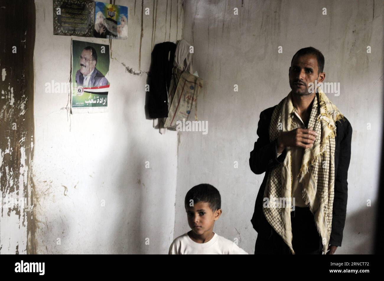 (160420) -- SANAA, April 20, 2016 -- A man from a poor family stands ...