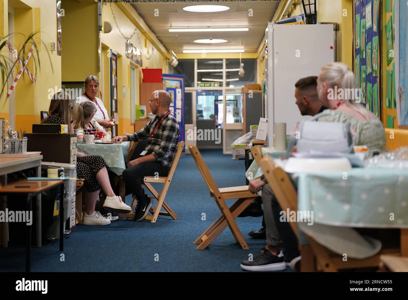 Head teacher Caroline Evans (top left) and staff members sit in a ...