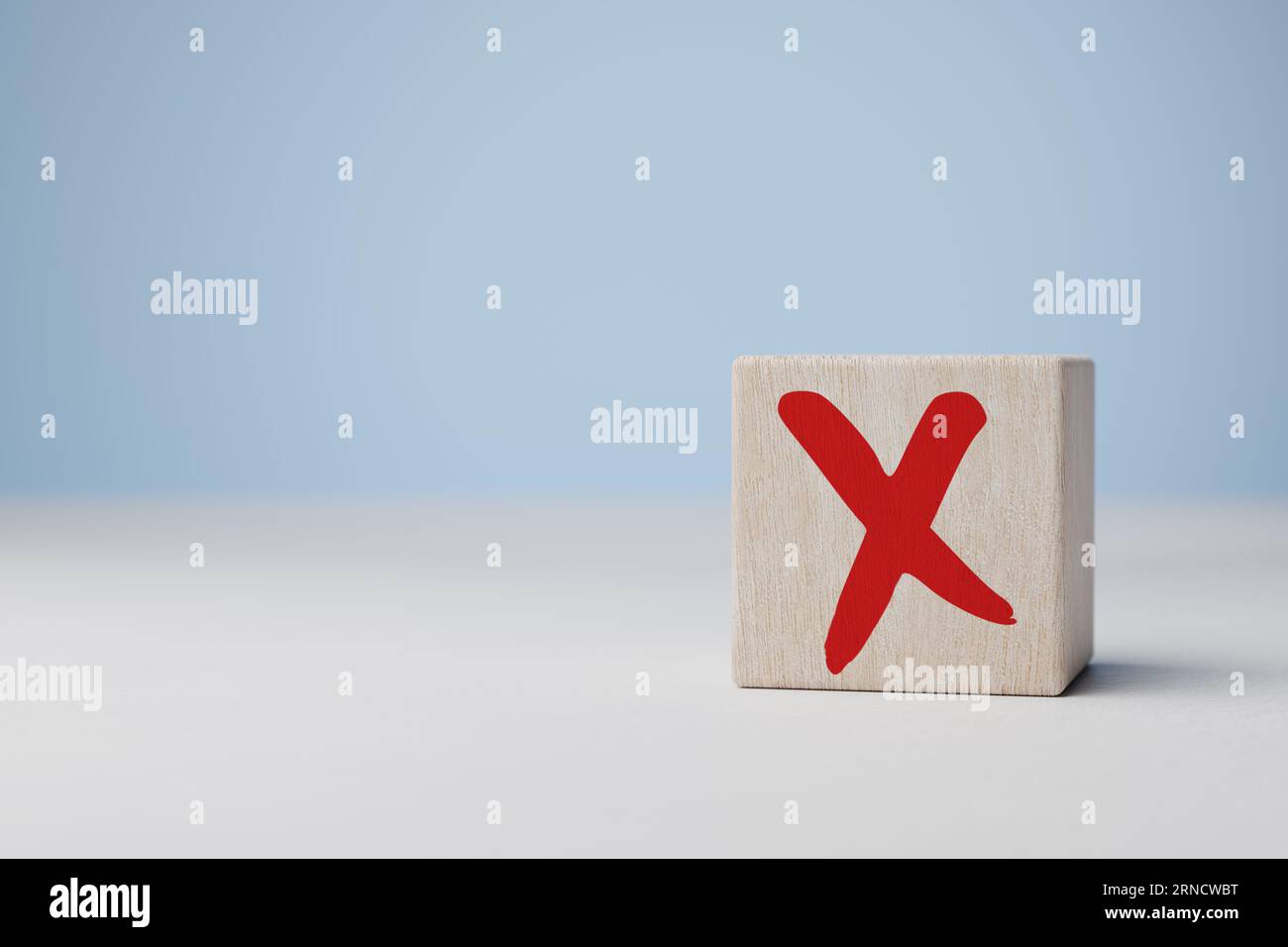 Cross mark x on wooden cube. Rejection sign in wooden cube stack ...