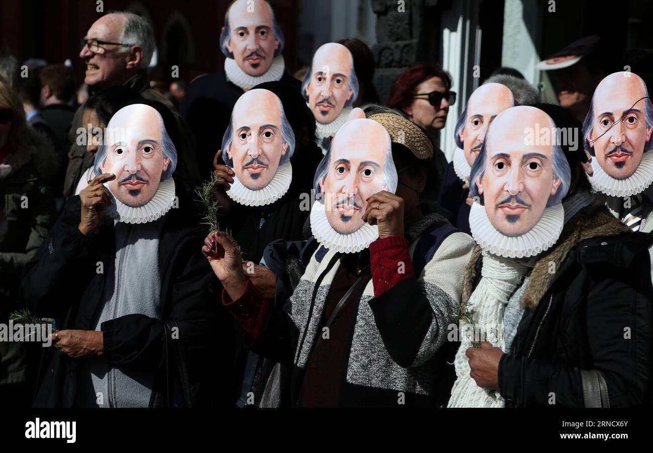 People put on their masks of William Shakespeare during the Mask Moment ...