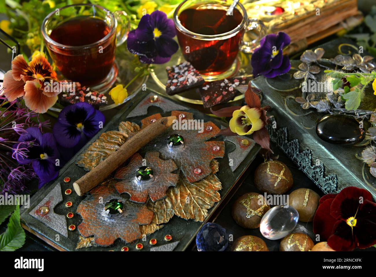 Still life with magic book of spells, runes and flowers. Occult ...