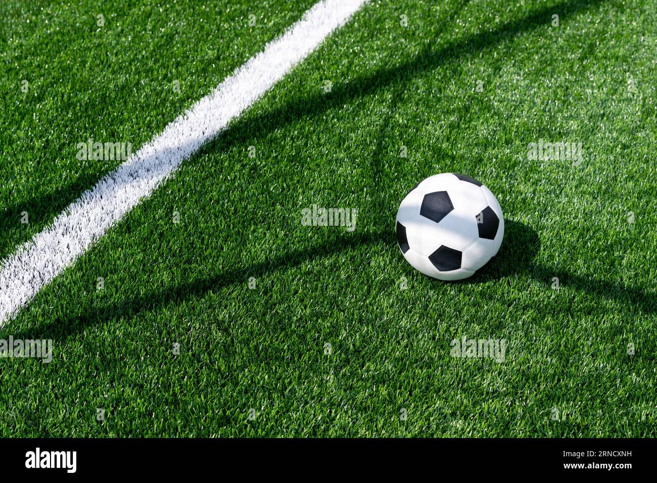 Black and white soccer and football ball in the field. Horizontal sport ...
