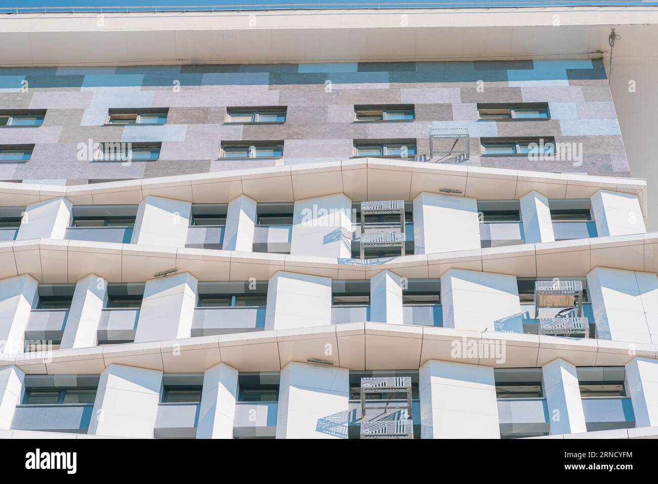 New building facade in housing complex. Modern style in architecture ...