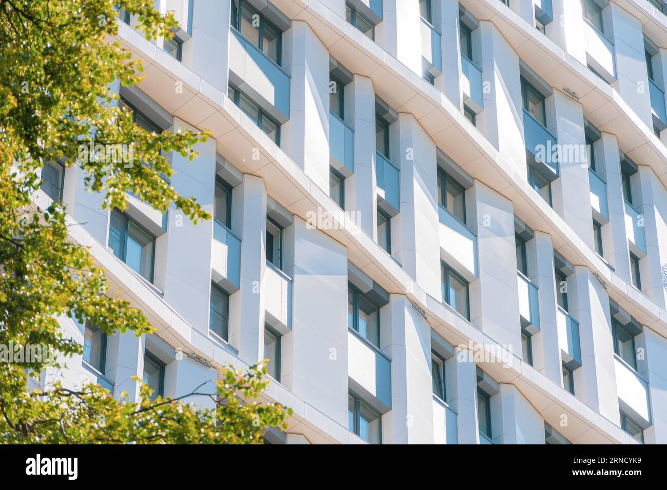 New building facade in housing complex. Modern style in architecture ...