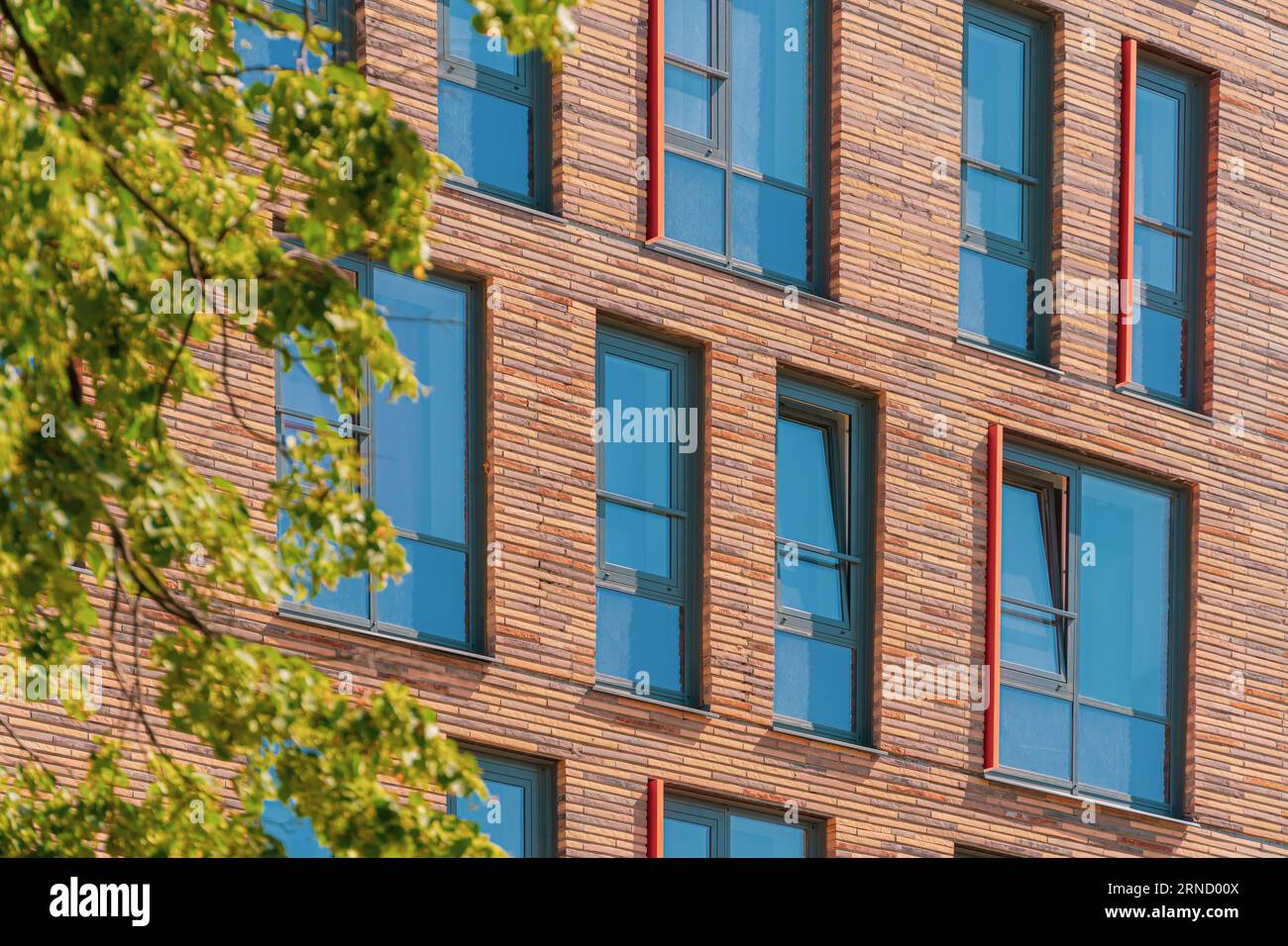 New building facade in housing complex. Modern style in architecture ...