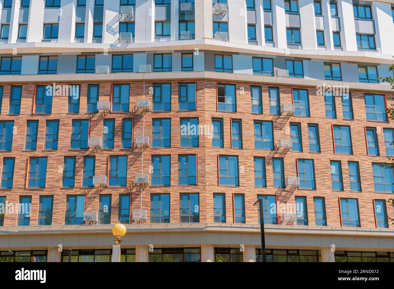 New building facade in housing complex. Modern style in architecture ...