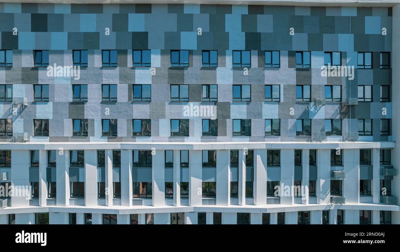 New building facade in housing complex. Modern style in architecture ...