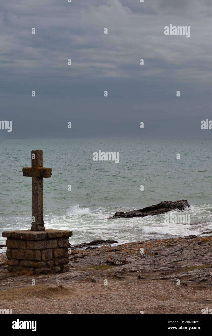 The Atlantic coast cut out in bad weather with a granite Catholic cross ...