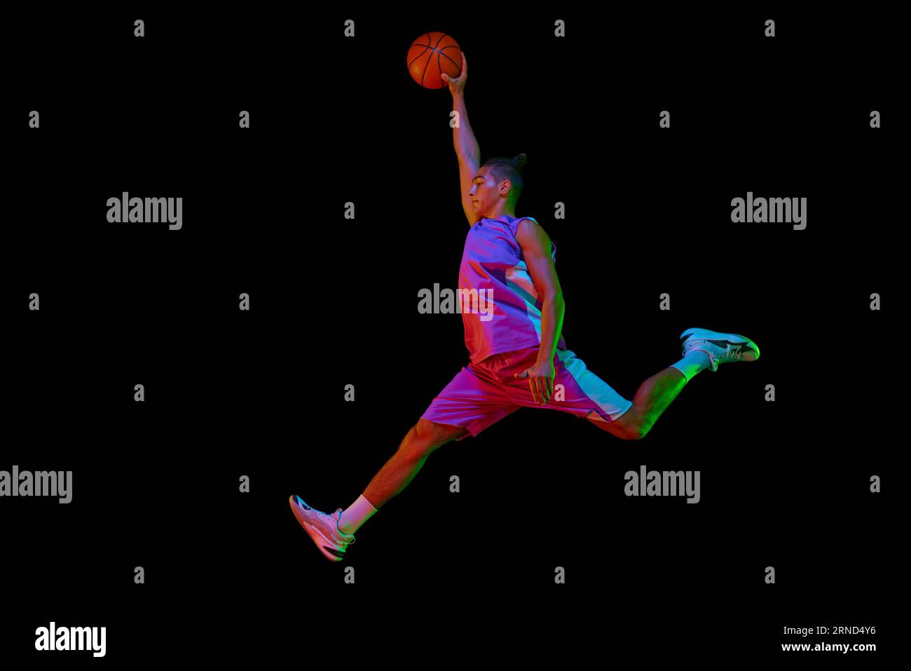 Slam dunk. Winning goal. Teen boy playing basketball, throwing ball in ...