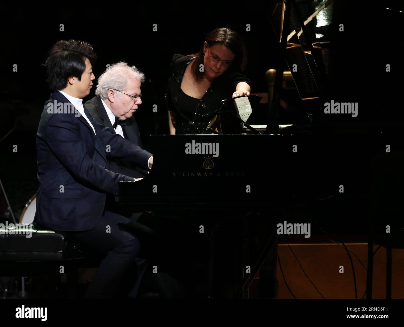 Chinese pianist Lang Lang (1st L) and American pianist Emanuel Ax (2nd ...