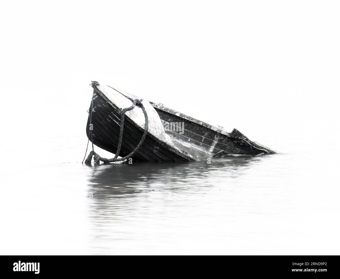 A small boat sinking, mono black and white, in river Stock Photo - Alamy